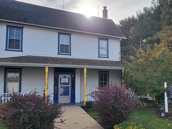The white farmhouse with its wraparound porch isn't just charming&mdash;it's a culinary fortress guarding Delaware's fried chicken secrets. That rooster means business!