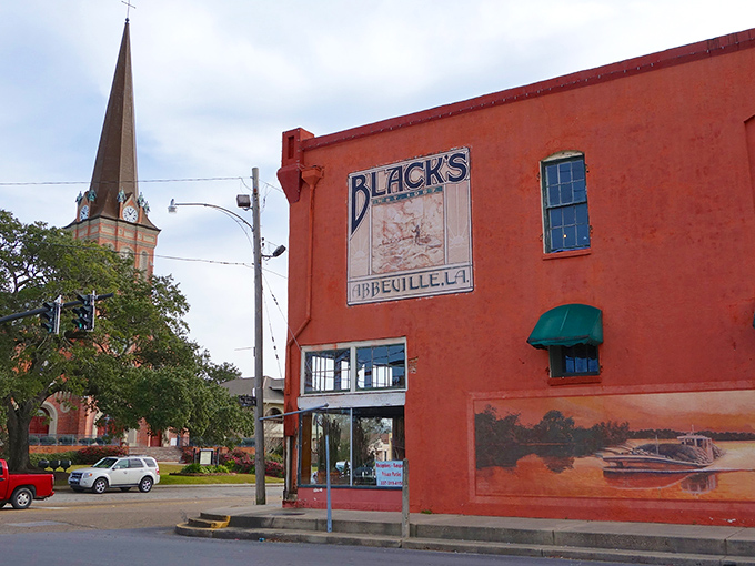 Abbeville's historic downtown showcases its Cajun charm, where Black's storefront stands proudly against the backdrop of that magnificent church spire.