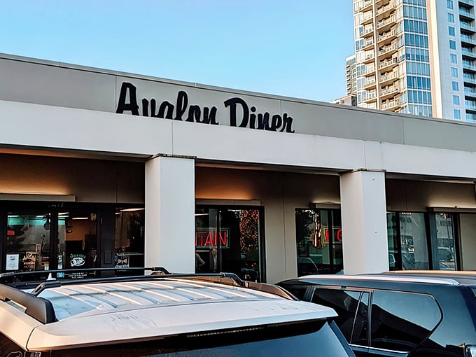 Avalon Diner's iconic storefront promises a trip back in time. The neon sign beckons like an old friend saying "breakfast is served!"