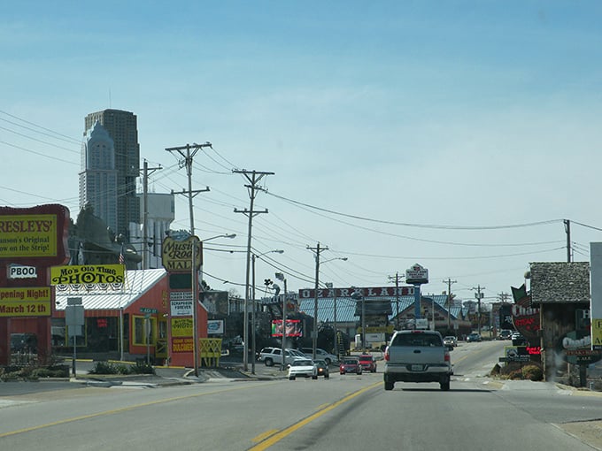 Branson's main strip buzzes with energy! Colorful storefronts and neon signs create that perfect blend of small-town charm and tourist-friendly excitement.