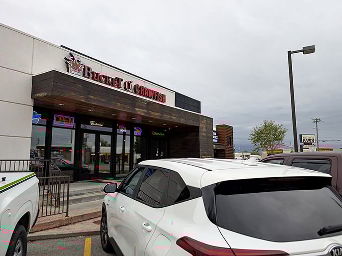 The wooden facade of Bucket O' Crawfish promises a no-nonsense seafood experience. Like finding a treasure chest in a strip mall!
