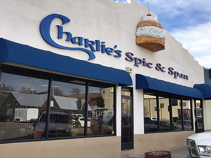 Charlie's iconic cinnamon roll sign is like a pastry lighthouse guiding hungry travelers to breakfast paradise.