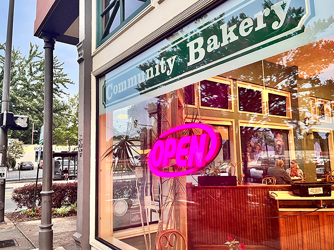Community Bakery's storefront welcomes you with a cheerful "OPEN" sign &ndash; the universal symbol for "donuts are happening here!"