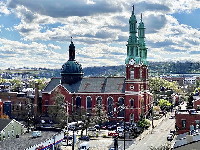 Covington's historic church spires reach skyward like architectural exclamation points, demanding attention against Kentucky's blue canvas.