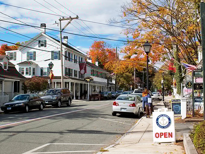 Autumn leaves frame your stroll through historic Essex, where charming white buildings and nautical signs welcome you to a classic.