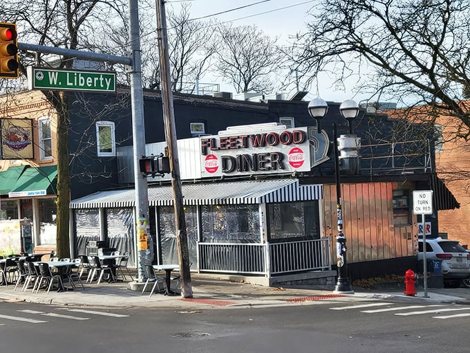 The iconic Fleetwood Diner sign beckons hungry travelers like a neon lighthouse on Ann Arbor's Ashley Street. Classic Americana at its finest!