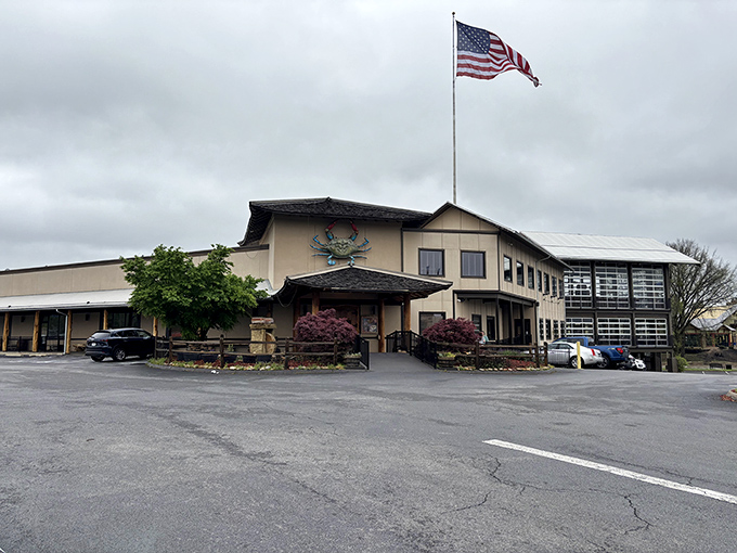 The American flag waves proudly above this seafood fortress, where crab dreams come true and butter flows freely.