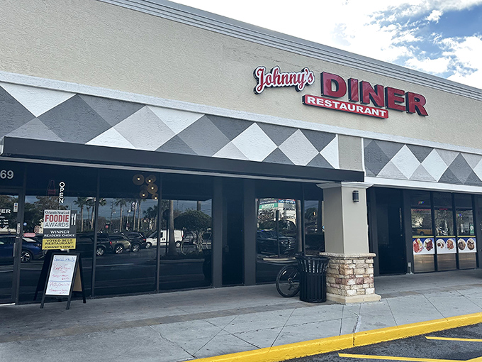 Johnny's Diner's classic black and white exterior promises the kind of breakfast that makes morning people out of night owls.