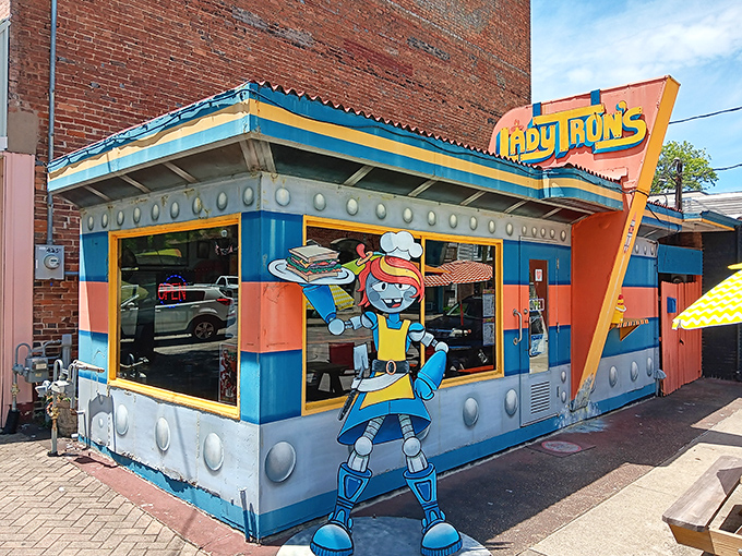 Lady Tron's exterior is like a portal to a robot utopia – bright blue, orange, and packed with retro sci-fi charm!