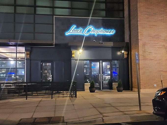 Law's Chophouse (exterior night): "That blue neon glow isn't just a sign&mdash;it's a beacon calling all steak lovers home to paradise."