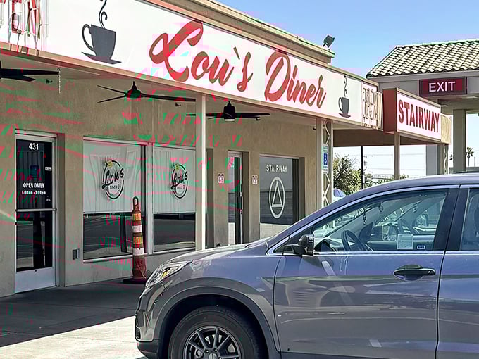 Lou's Diner's iconic red sign promises comfort food that'll make you forget your diet faster than you can say "extra bacon."
