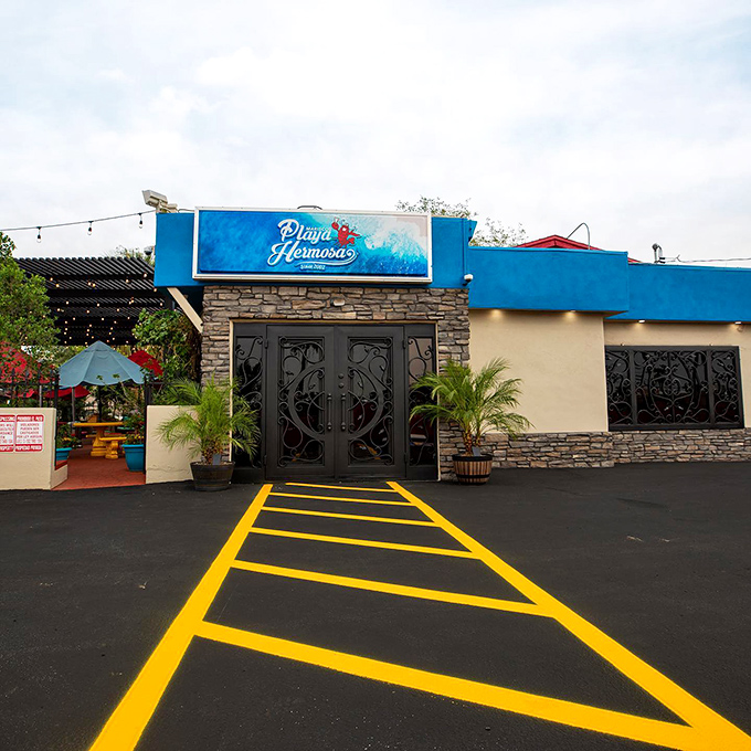 The blue facade of Playa Hermosa beckons like a coastal mirage in the desert. Those stone accents aren't just for show&mdash;they're guarding seafood treasures inside!
