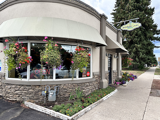 Mirror Lake Diner's stone facade and colorful flower baskets - where small-town charm meets big-time breakfast in the heart of Kamas.