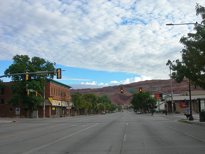 Desert highways like this lead to Moab's red rock wonderland, where adventure calls from every canyon. 