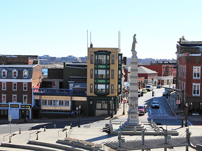 Classic yellow colonial homes line New London's streets, where coastal charm meets budget-friendly living. 