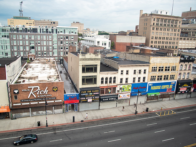 Downtown Newark's skyline tells a story of urban renewal, where historic brick buildings meet modern glass structures in New Jersey's largest city.