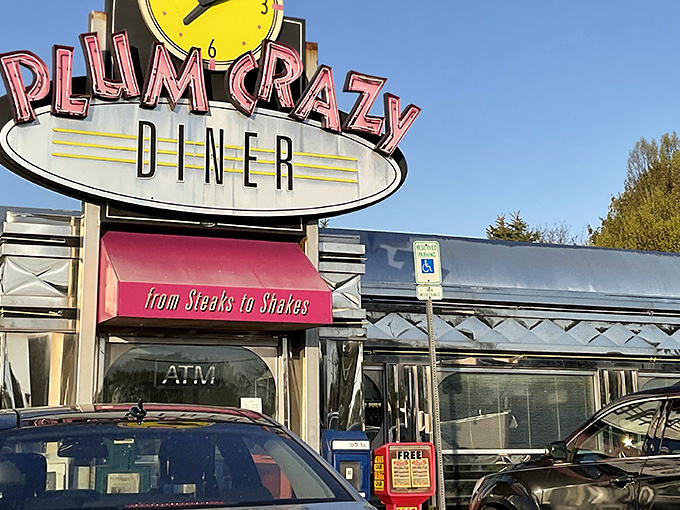 The neon glow of Plum Crazy Diner beckons like a time machine to the 1950s, promising classic comfort from "Steaks to Shakes."