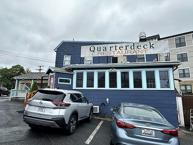 The blue exterior of Quarterdeck might not win beauty contests, but locals know this Arlington crab haven hides seafood treasures inside!