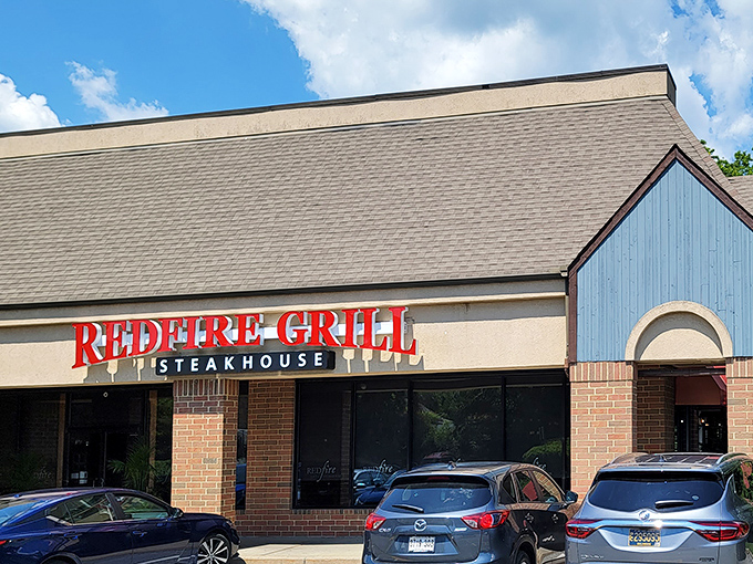 Redfire Grill's bold sign promises what lies within&mdash;a temple of perfectly seared beef that'll make your taste buds stand at attention.