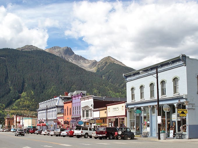 The Red Feather Trading Post stands like a friendly sentinel, where locals swap stories as freely as they buy supplies.