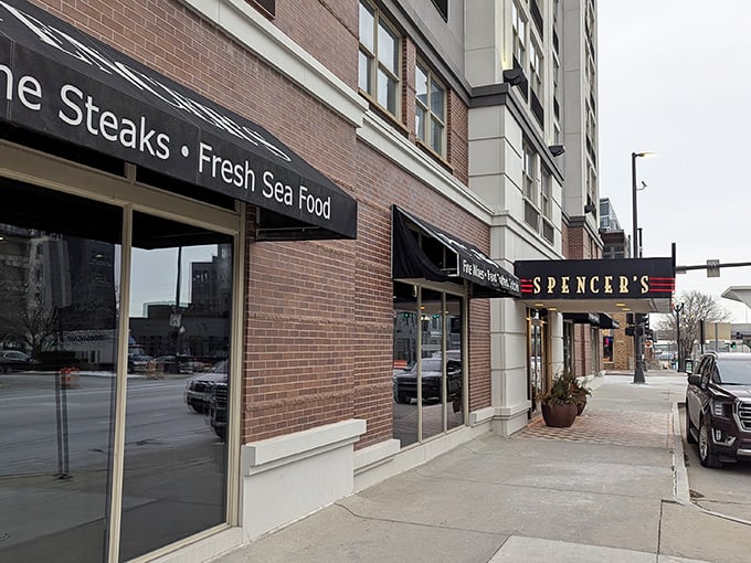 Spencer's interior gleams with elegance &ndash; that chandelier isn't messing around! Serious steak business happens beneath that sparkling masterpiece.