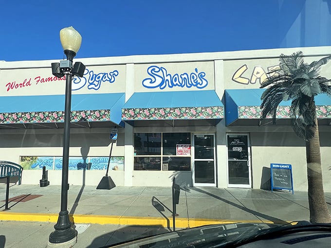 Sugar Shane's blue storefront promises tropical vibes in the heart of Kansas. That "World Famous" sign might be a stretch, but the pancakes just might prove it right!