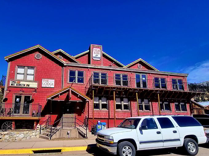 Texas Reds Steakhouse stands tall in its vibrant red glory, like a steak-lover's beacon calling you home after a long day on the range.