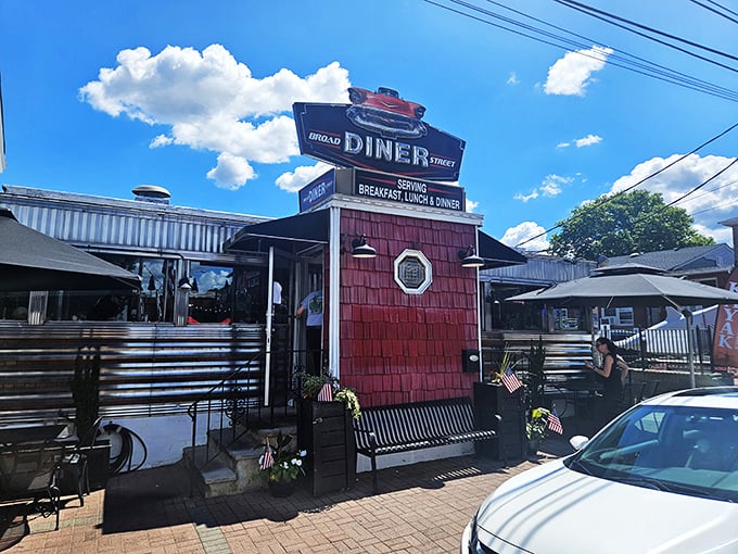 The Broad Street Diner stands proud with its cherry-red shingles and classic chrome &ndash; like finding a time machine disguised as breakfast heaven!