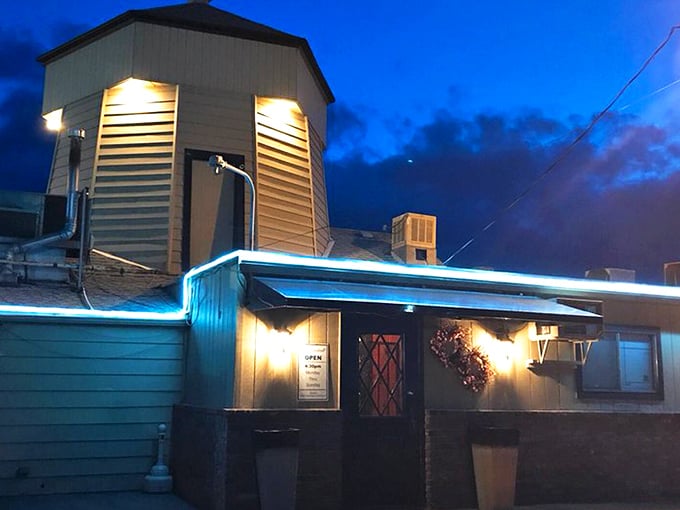 The Windmill Restaurant (Wenatchee): The iconic windmill silhouette against the twilight sky &ndash; a beacon for hungry travelers seeking steak salvation in Wenatchee.