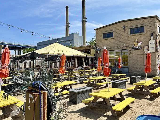 Yellow picnic tables at Twisted Fisherman create a beachy oasis in urban Milwaukee. Sunshine, cold beer, and fresh seafood&mdash;what more could you want?