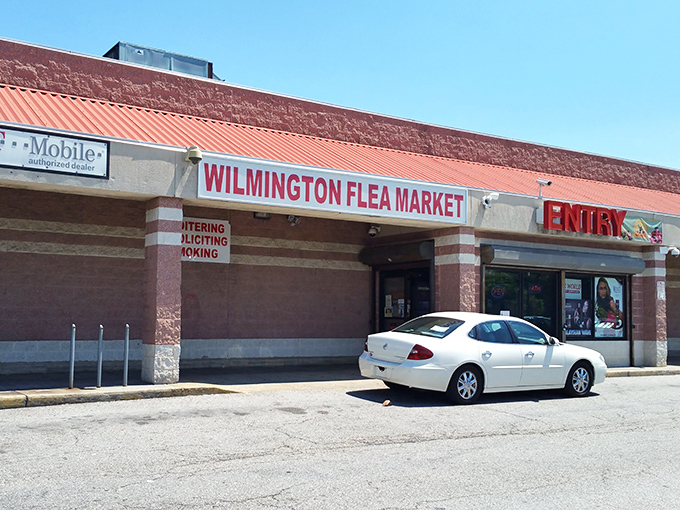 The unassuming entrance to Wilmington Flea Market - where ordinary storefronts hide extraordinary treasures waiting to be discovered.