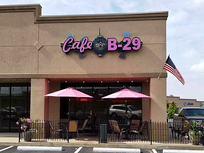 Pink umbrellas dot the patio at Cafe B-29, where diners can watch clouds drift by while savoring classic American fare.