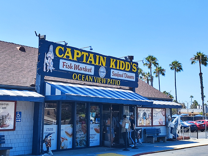Blue and white awnings flapping in the ocean breeze, Captain Kidd's promises treasures from the deep without the fancy pirate prices.