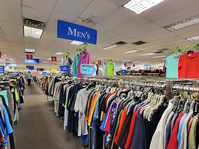 Rows upon rows of neatly organized clothing await at DAV Thrift. It's like a rainbow of fashion possibilities on hangers!