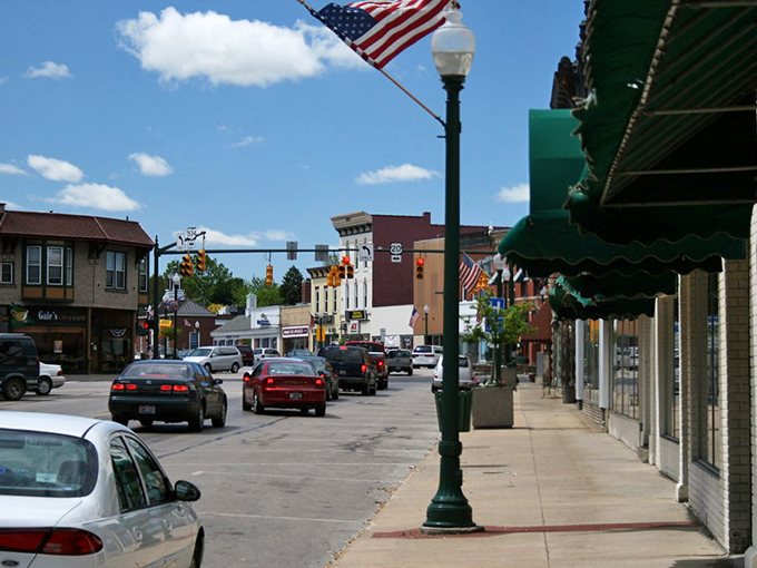 Main Street America at its finest. American flags wave proudly over Geneva's welcoming downtown where neighbors still chat on sidewalks.