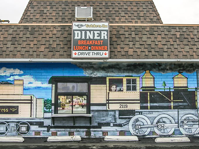 All aboard the flavor express! This painted locomotive mural transforms a simple diner into a railway adventure.