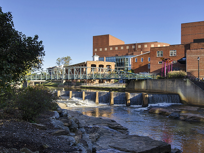 The Reedy River cascades through downtown Greenville, where nature's waterfall show plays daily&mdash;no admission required!