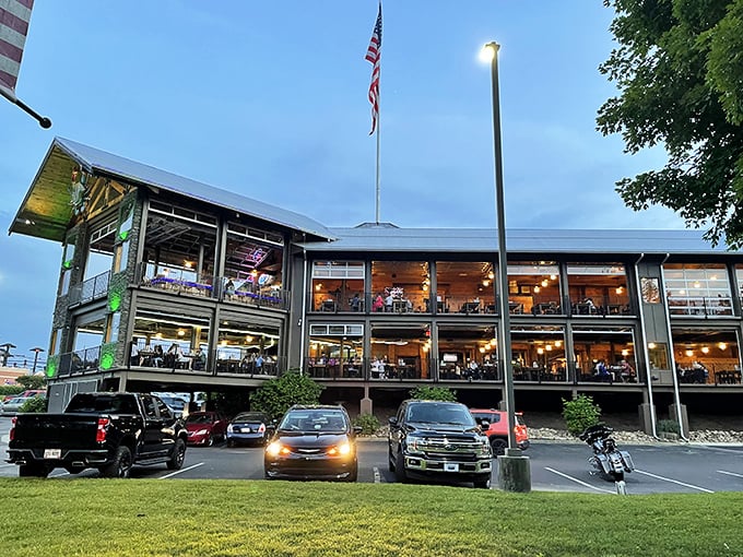 As night falls, this multi-level seafood paradise lights up like a beacon for hungry travelers seeking maritime treasures.