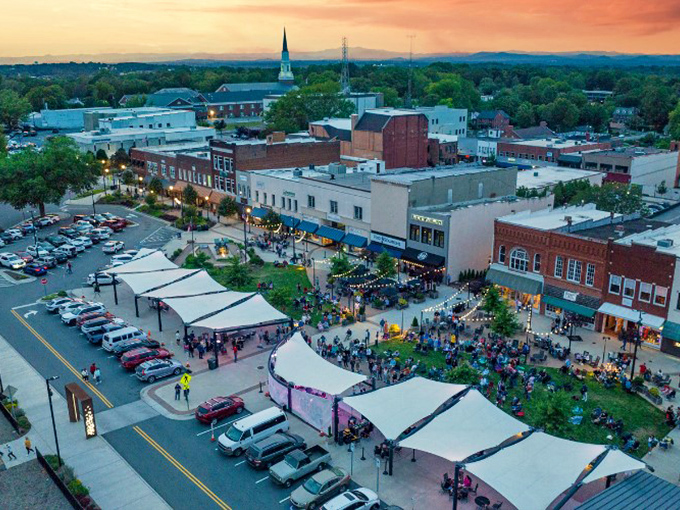 Sunset over Hickory's vibrant downtown square, where community events often bring neighbors together without breaking the bank. A perfect example of affordable living with character.