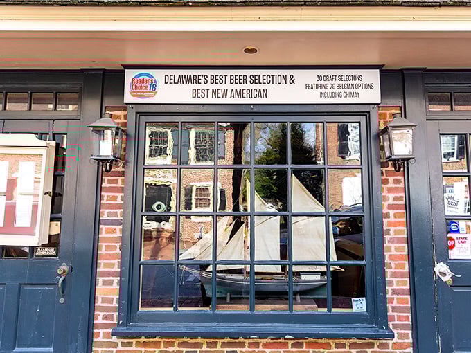 A window into the past! Jessop's storefront proudly displays its "Delaware's Best Beer Selection" credentials alongside historic brick and lantern lighting.