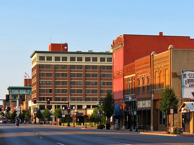 Sunset bathes Joplin's Main Street in golden light, where Social Security dollars stretch further amid these beautifully preserved architectural treasures.