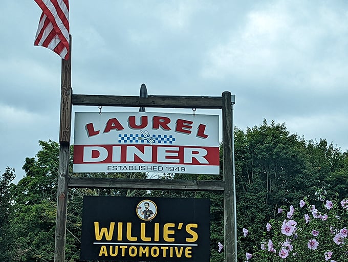 Morning sunshine and American flags frame the Laurel Diner sign &ndash; where pancakes are practically a patriotic duty. 