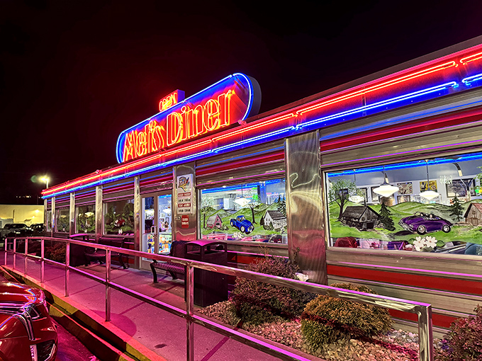 The neon glow of Mel's at night transforms this diner into a beacon for hungry night owls and early birds alike.