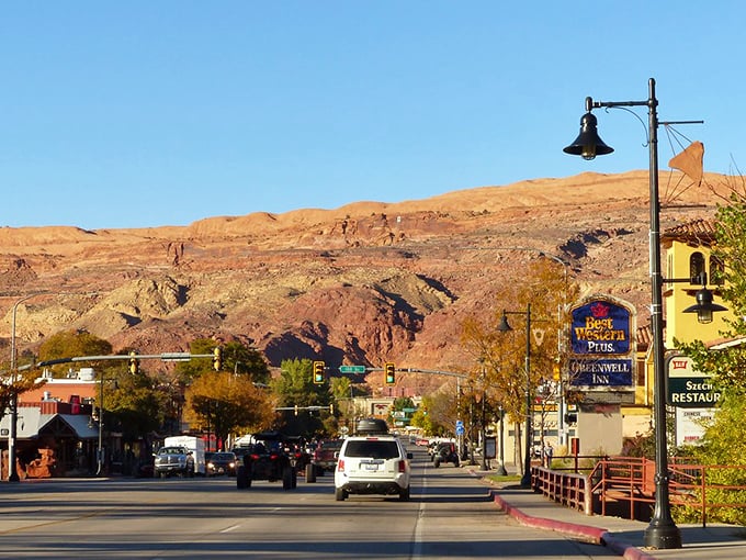 Moab's Main Street welcomes travelers with that perfect small-town charm framed by towering sandstone cliffs.