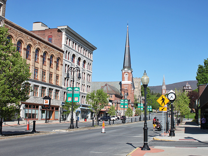 Main Street's colorful charm offers a postcard-perfect scene where church spires reach skyward against the backdrop of Berkshire mountains.