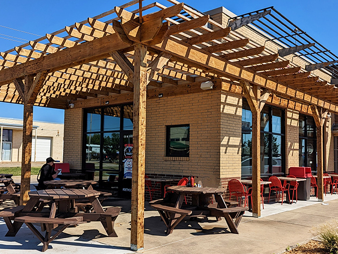 Wooden pergolas and picnic tables create the perfect laid-back vibe for enjoying seafood that doesn't need fancy surroundings to shine.