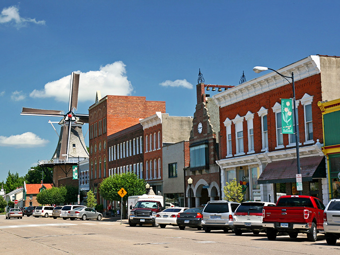 That's not Europe—it's Pella! The iconic windmill watches over brick streets where neighbors still sweep together before festivals.