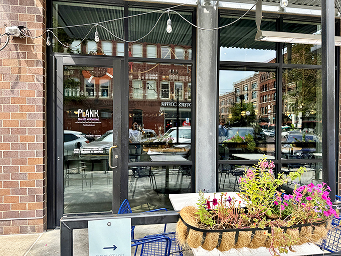 A glimpse through the glass reveals Plank's modern interior - simple, stylish, and all about letting the seafood shine.