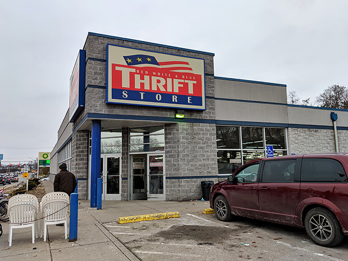 ."Shopping with purpose! This bright blue and red sign promises adventures in thrifting with every purchase making a difference."