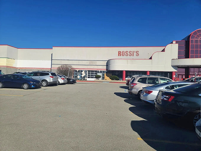 Farm-fresh rainbow! A shopper contemplates nature's bounty at Rossi's produce stand, where the colors rival any supermarket display.